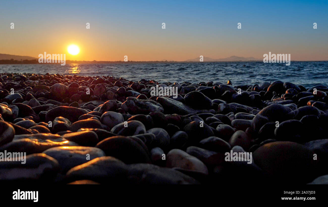 Sunset on the beach of Kos Island in greece Stock Photo - Alamy