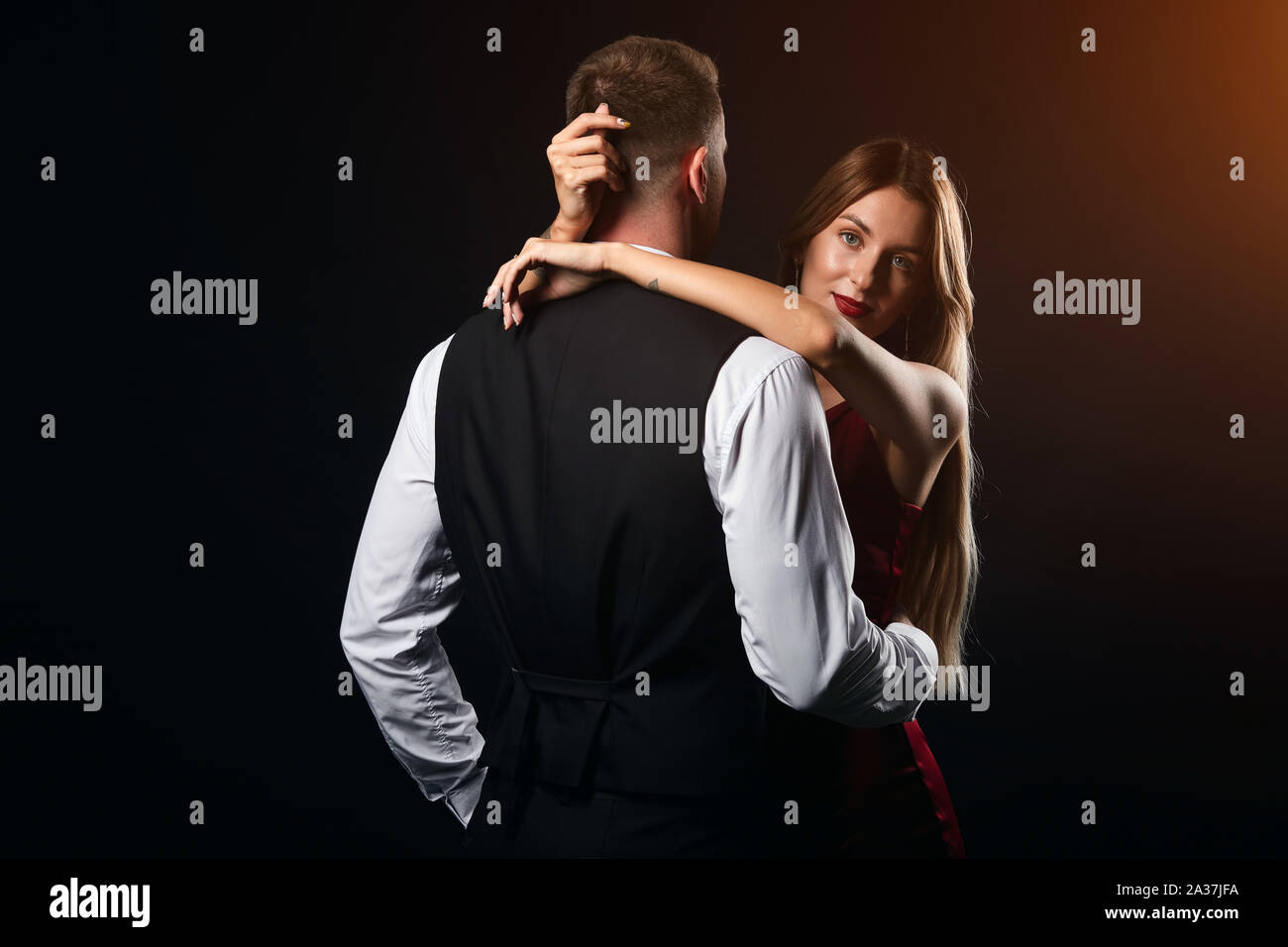 Cute stylish couple dancing together at the nightclub. close up ...