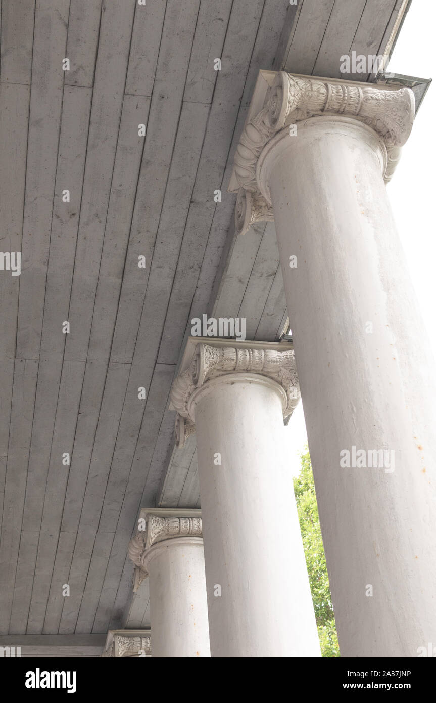 Element of an old column against a wood ceiling. Vintage element of ...
