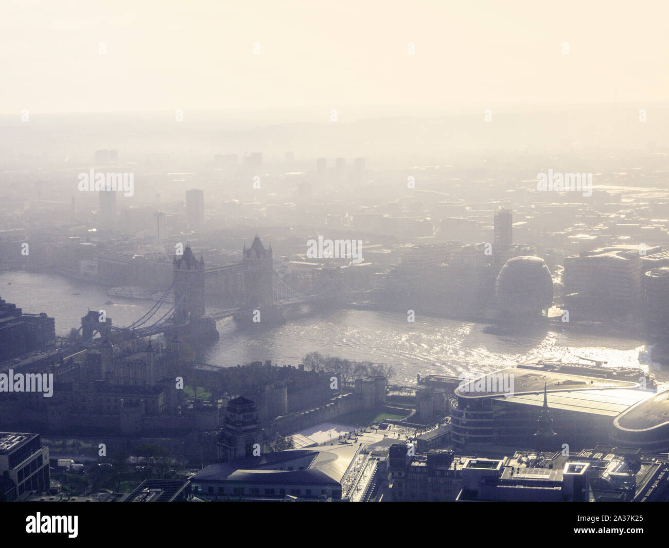 Dramatic shots of Tower Bridge and south London on a smoggy morning ...