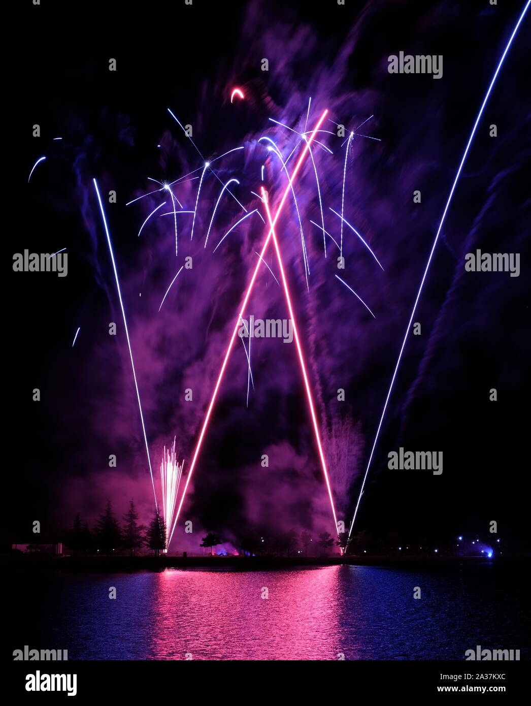V shaped multicolor firework Stock Photo - Alamy