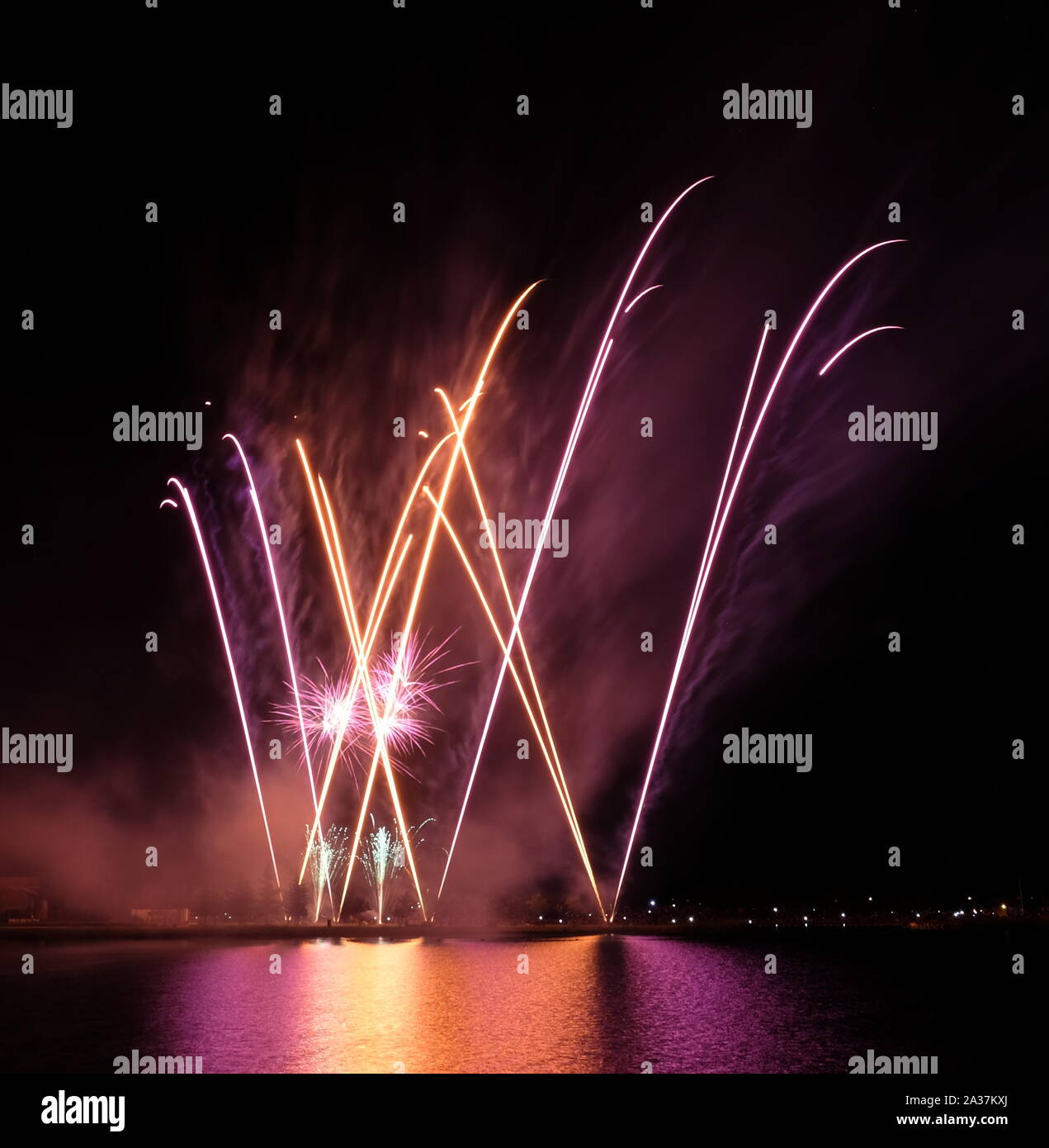 V shaped multicolor firework Stock Photo - Alamy