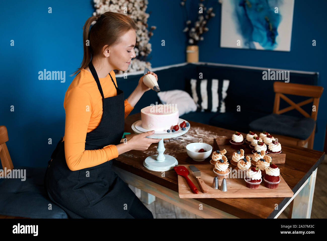 hardworking confectioner making dessert, close up side view photo. copy ...
