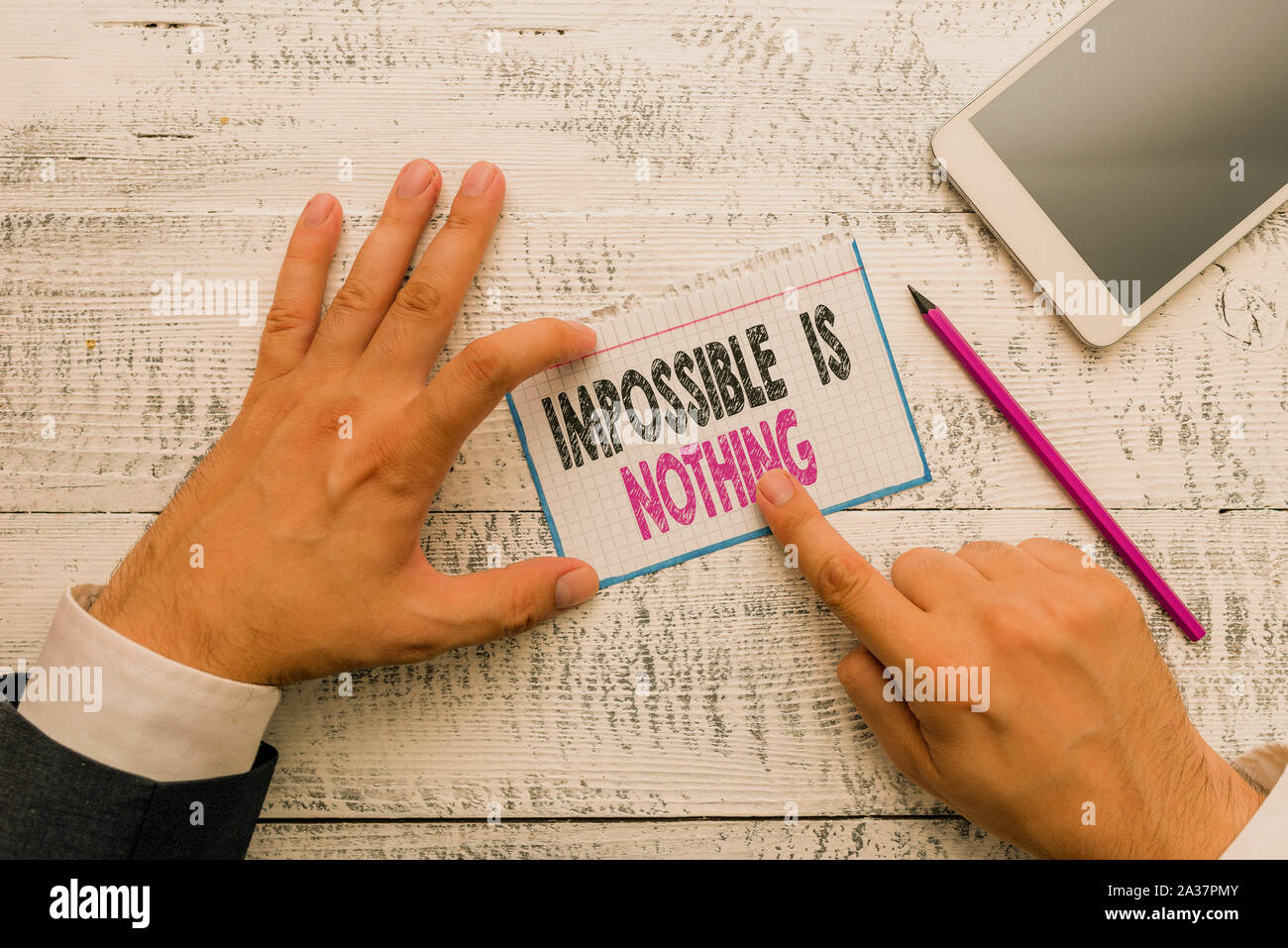 Writing note showing Impossible Is Nothing. Business concept for ...