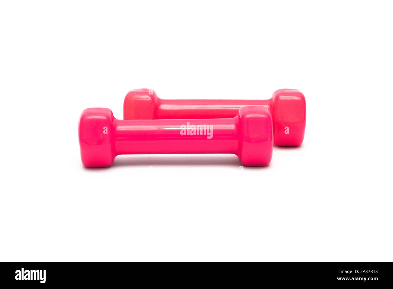 Two pink dumbbells isolated on white background Stock Photo - Alamy