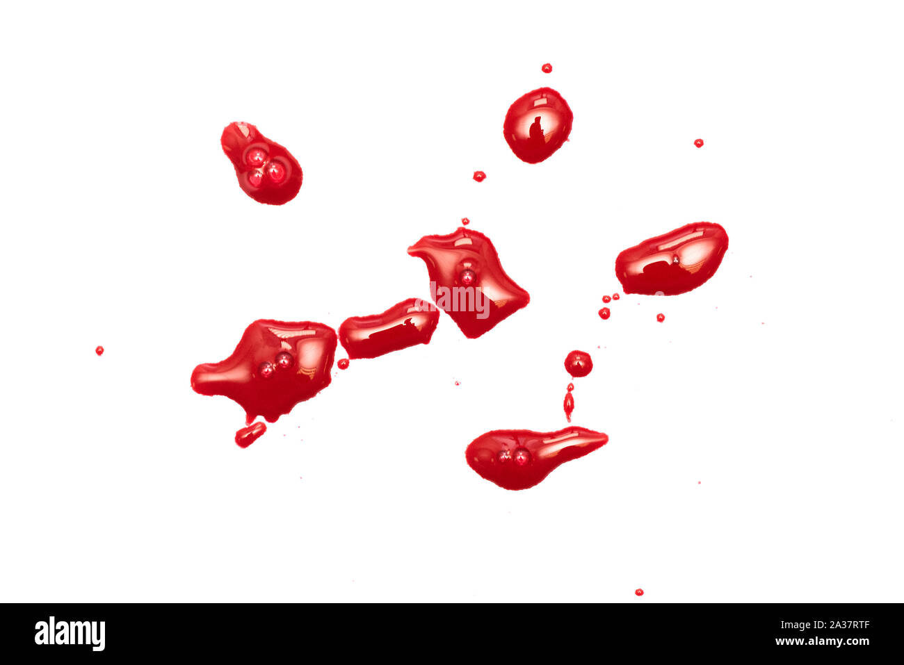 Red blots isolated on white background. Top view Stock Photo - Alamy