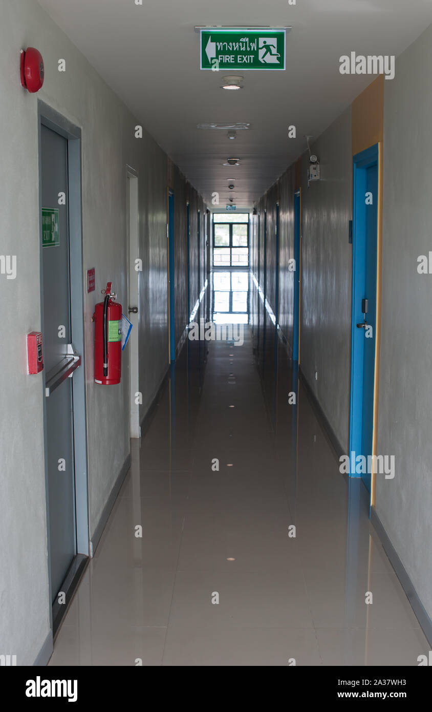Emergency fire exit sign direction to doorway in the building green ...