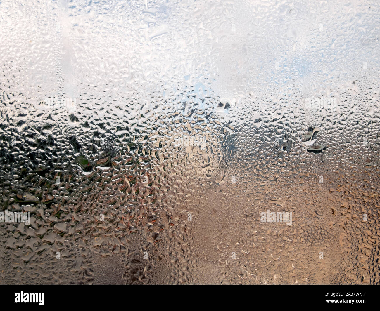 Wet and rainy, a close-up of water dropplets on a window pane. I was ...