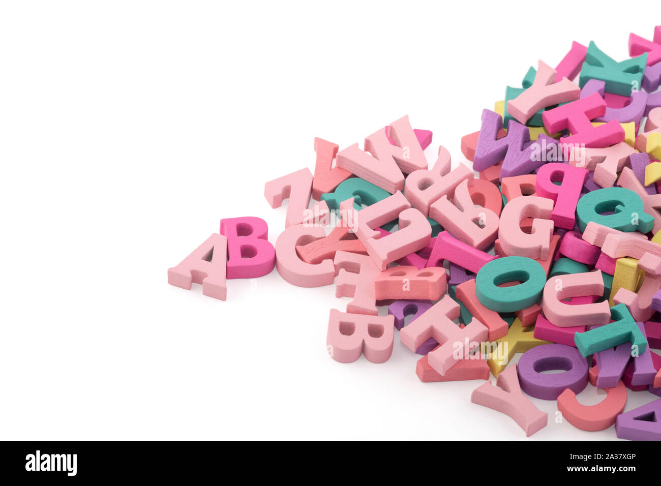 Pile of colorful painted wooden letters. Typography background ...