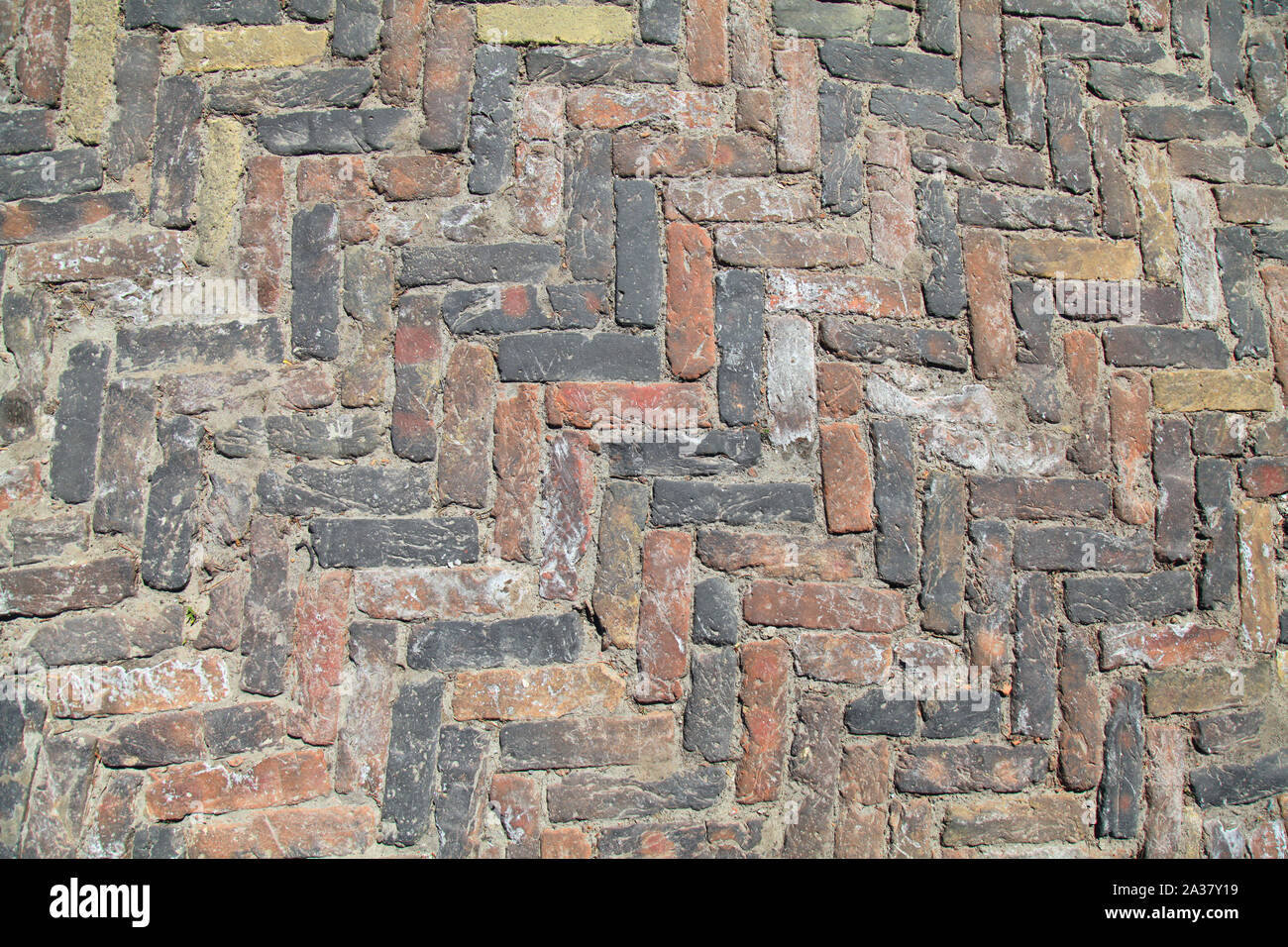 Paving blocks made of old stone of regular shape. Stone pavement ...