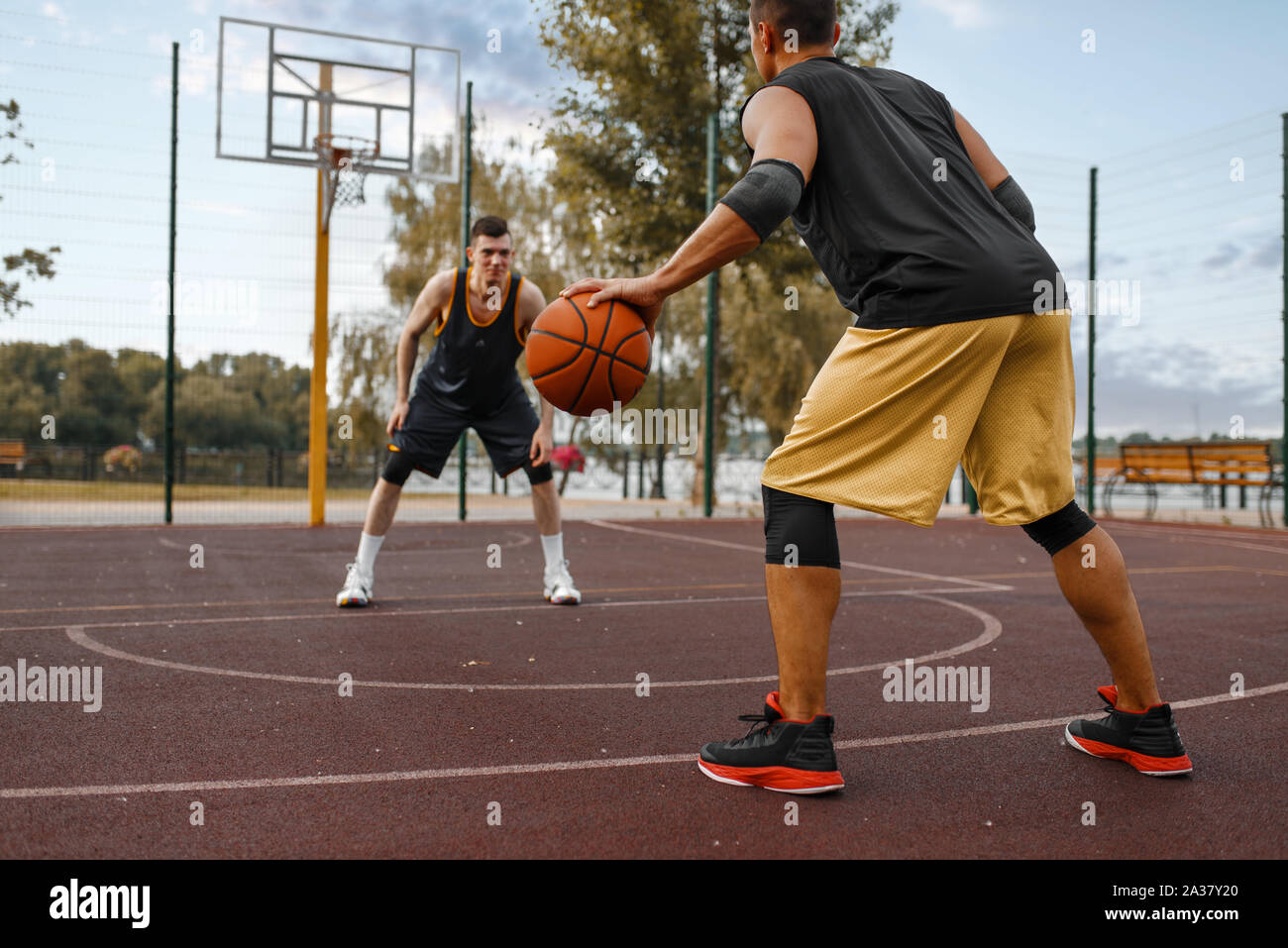Two basketball players work out tactics outdoor Stock Photo - Alamy