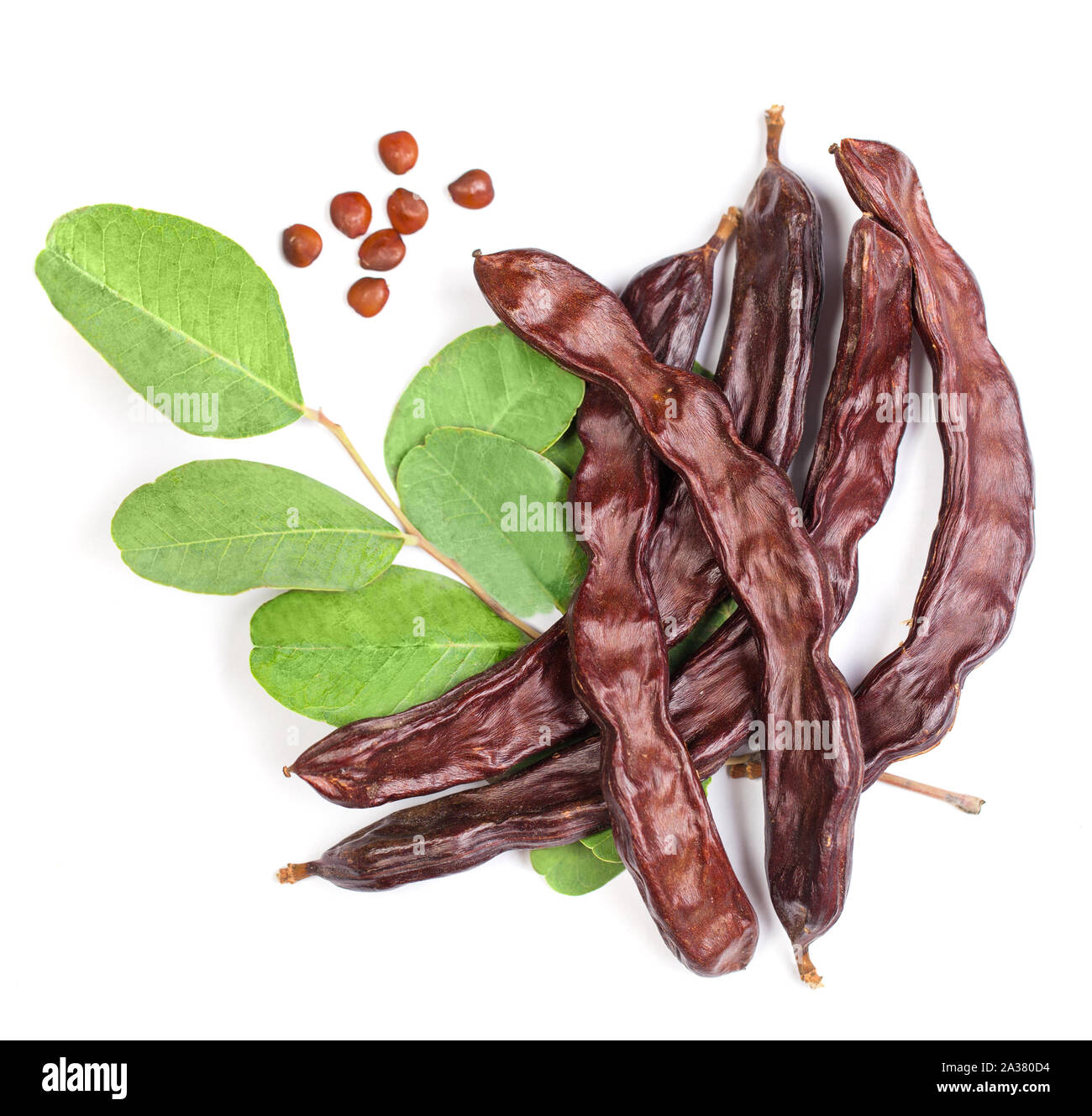 Carob pods and leaves Cut Out Stock Images & Pictures - Alamy