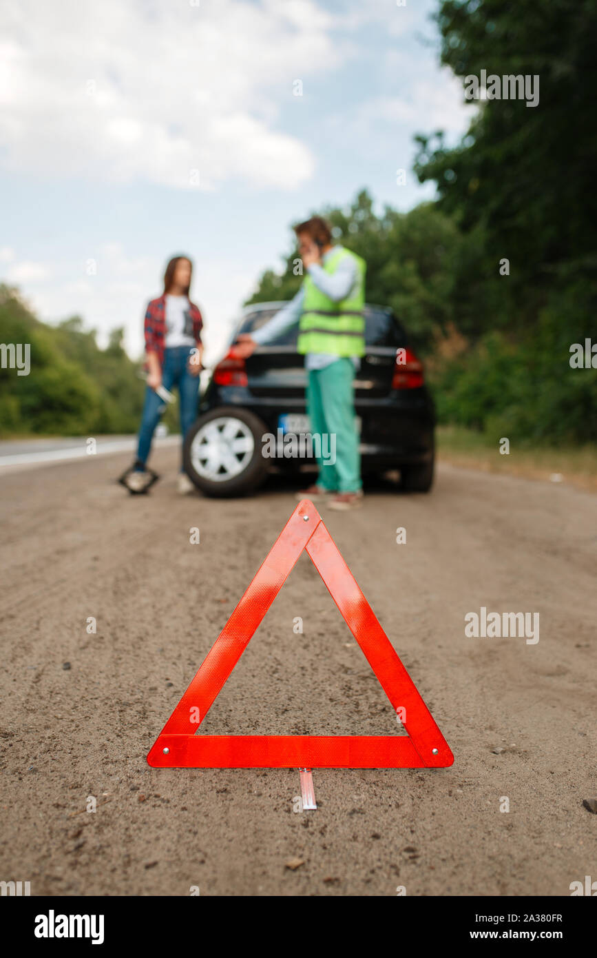 Emergency stop sign, flat tyre, punctured tire Stock Photo - Alamy