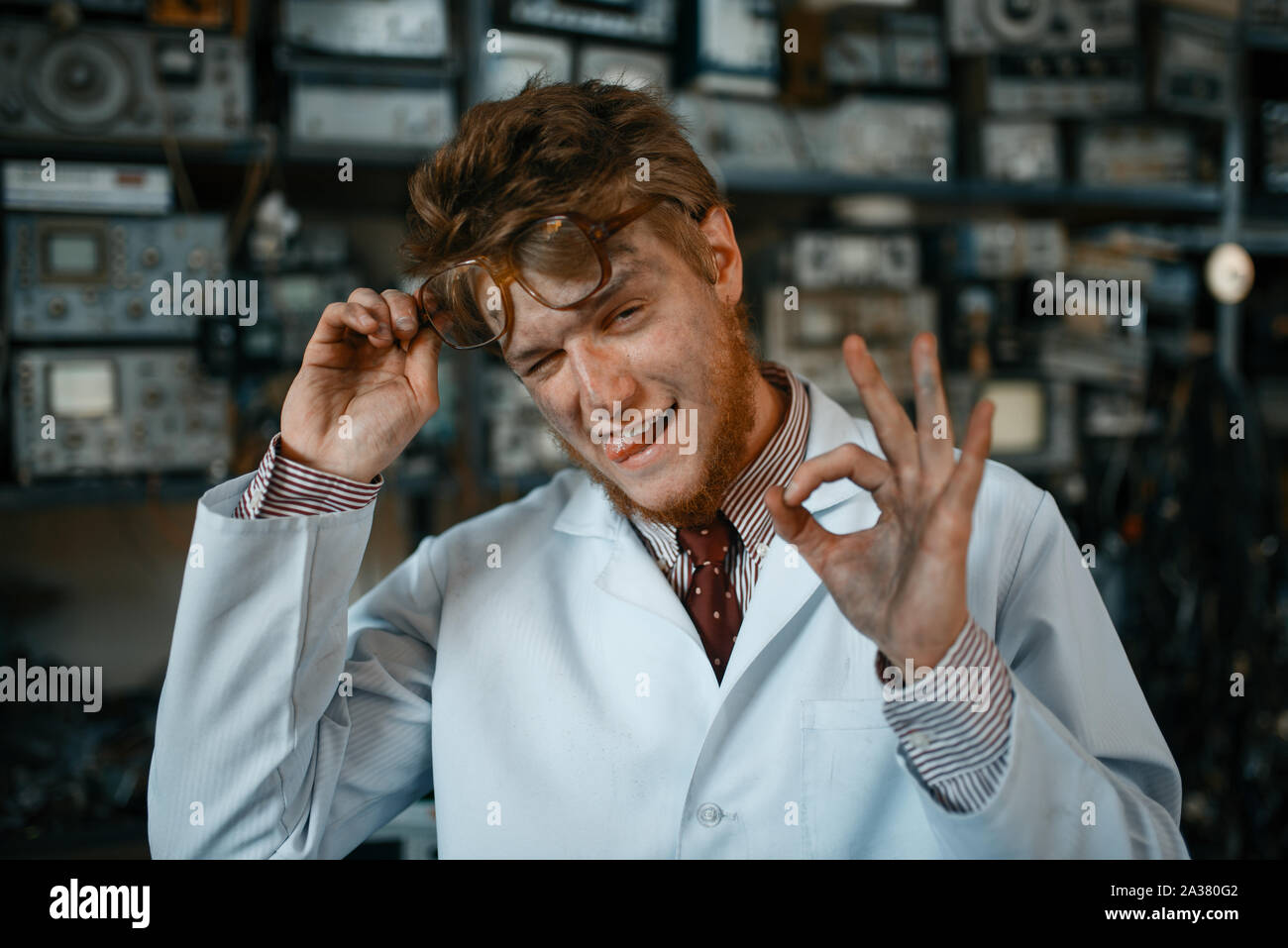 Strange male scientist shows OK sign in lab Stock Photo - Alamy