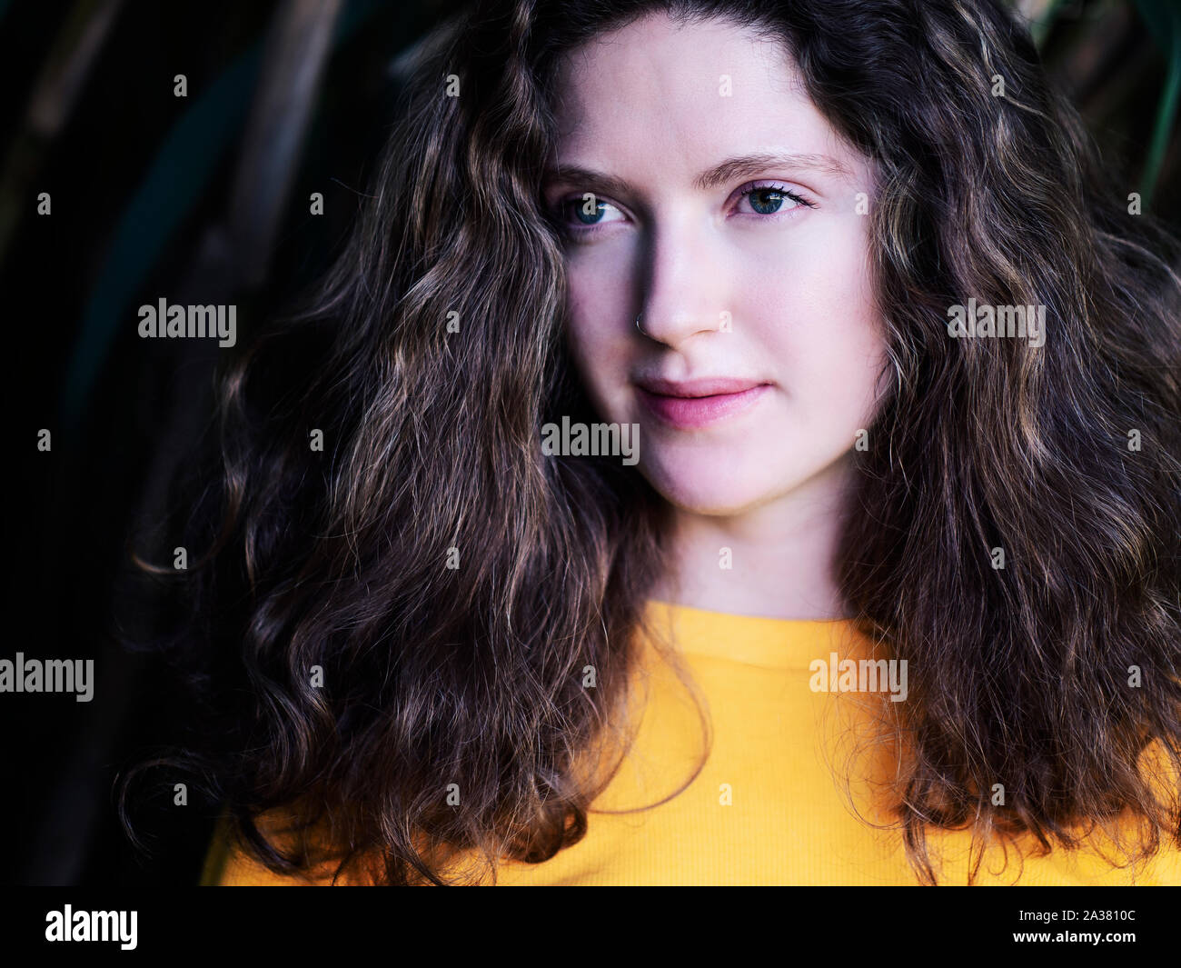 Beautiful young woman with gentle facial expression Stock Photo - Alamy
