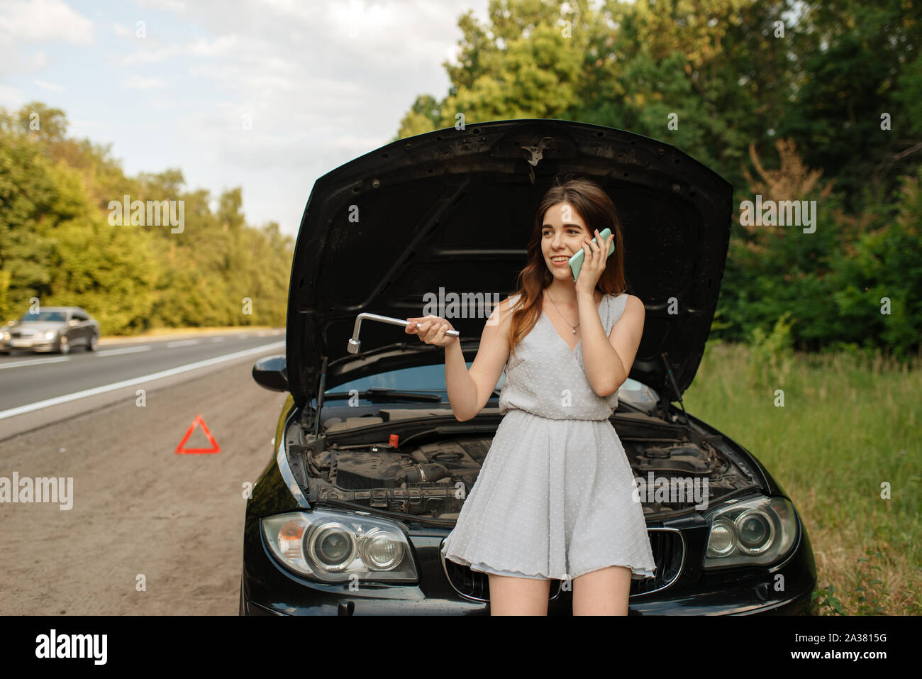 Car breakdown on highway woman hi-res stock photography and images - Alamy