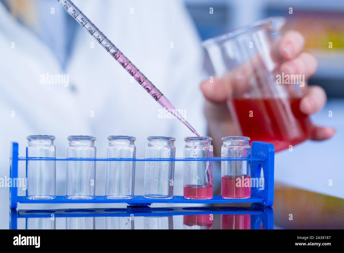 Using pipette in the laboratory Stock Photo - Alamy