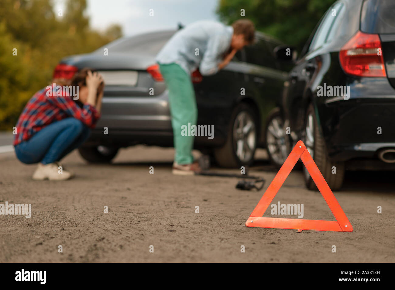 Car accident on road, male and female drivers Stock Photo - Alamy