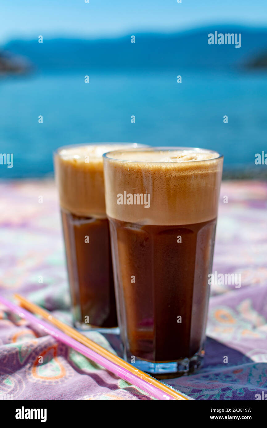 Traditional greek cold coffee Frappe with foam made from water, instant ...