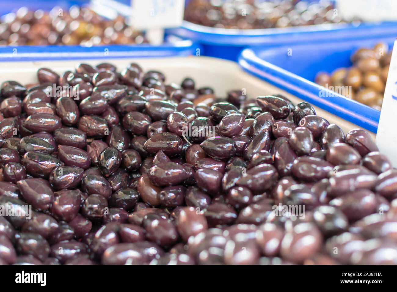 Traditional greek food ingredient, green olives in box on farmer market ...