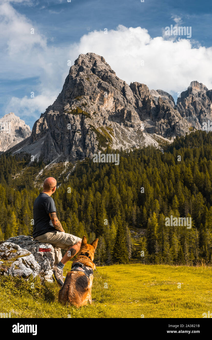 Adventure Man Sitting on Rock at Hiking Trial with Best Freind Dog ...