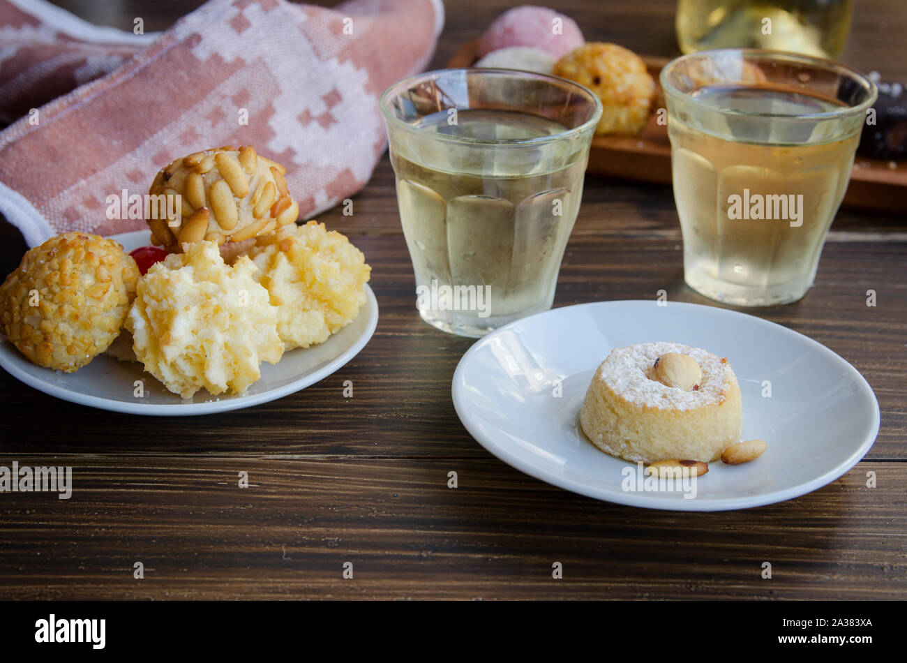 Panellets, different Catalan small cakes, served with sweet white wine ...
