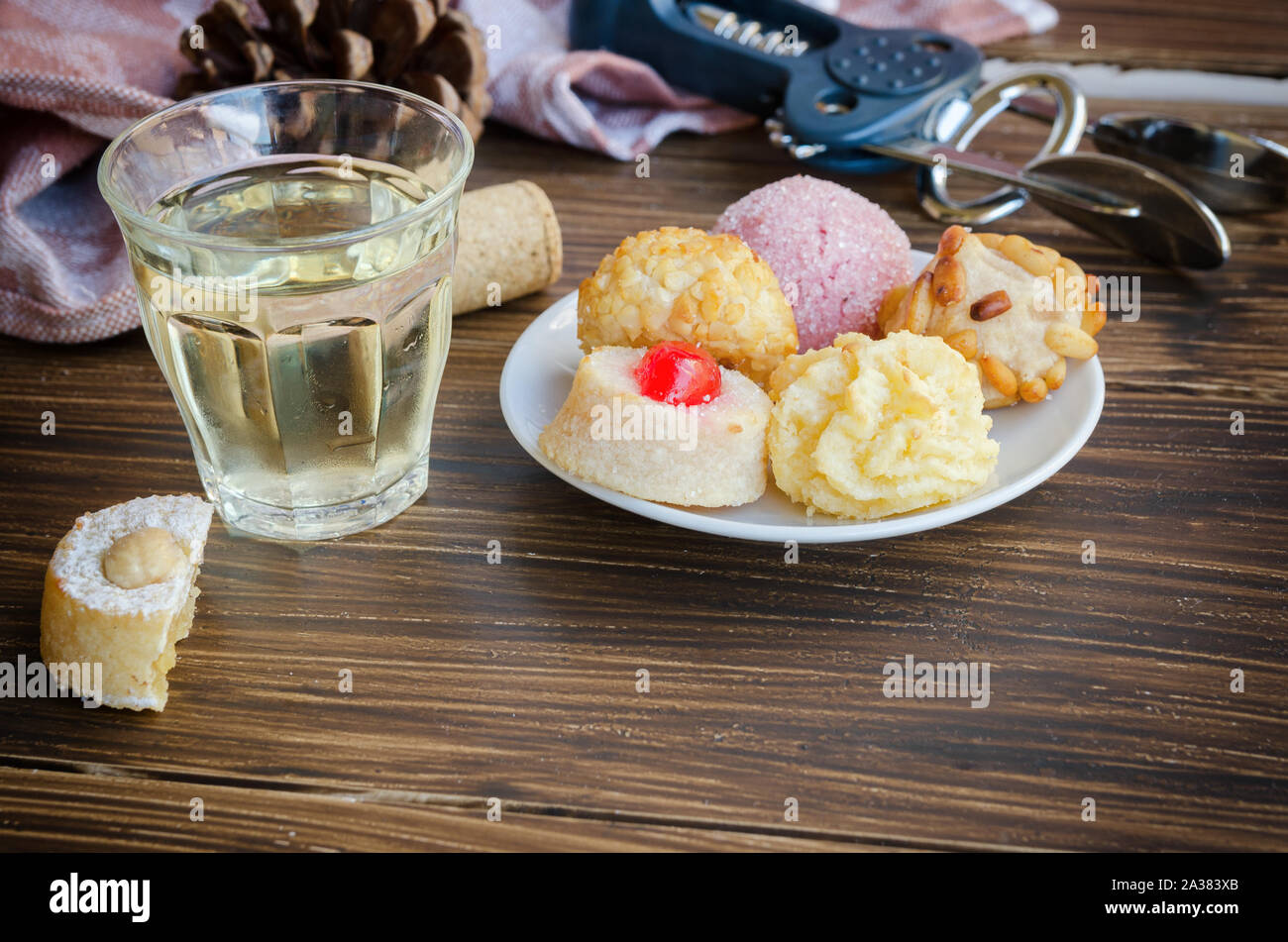 Panellets, different Catalan small cakes, served with sweet white wine ...