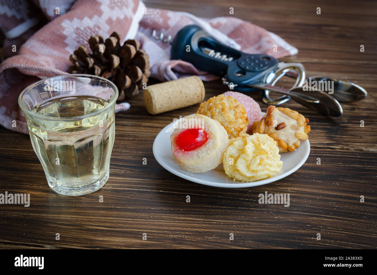 Panellets, different Catalan small cakes, served with sweet white wine ...
