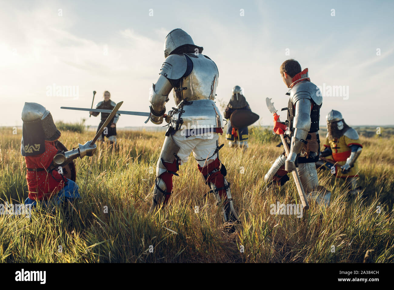 Medieval knights fight with sword and axe Stock Photo - Alamy