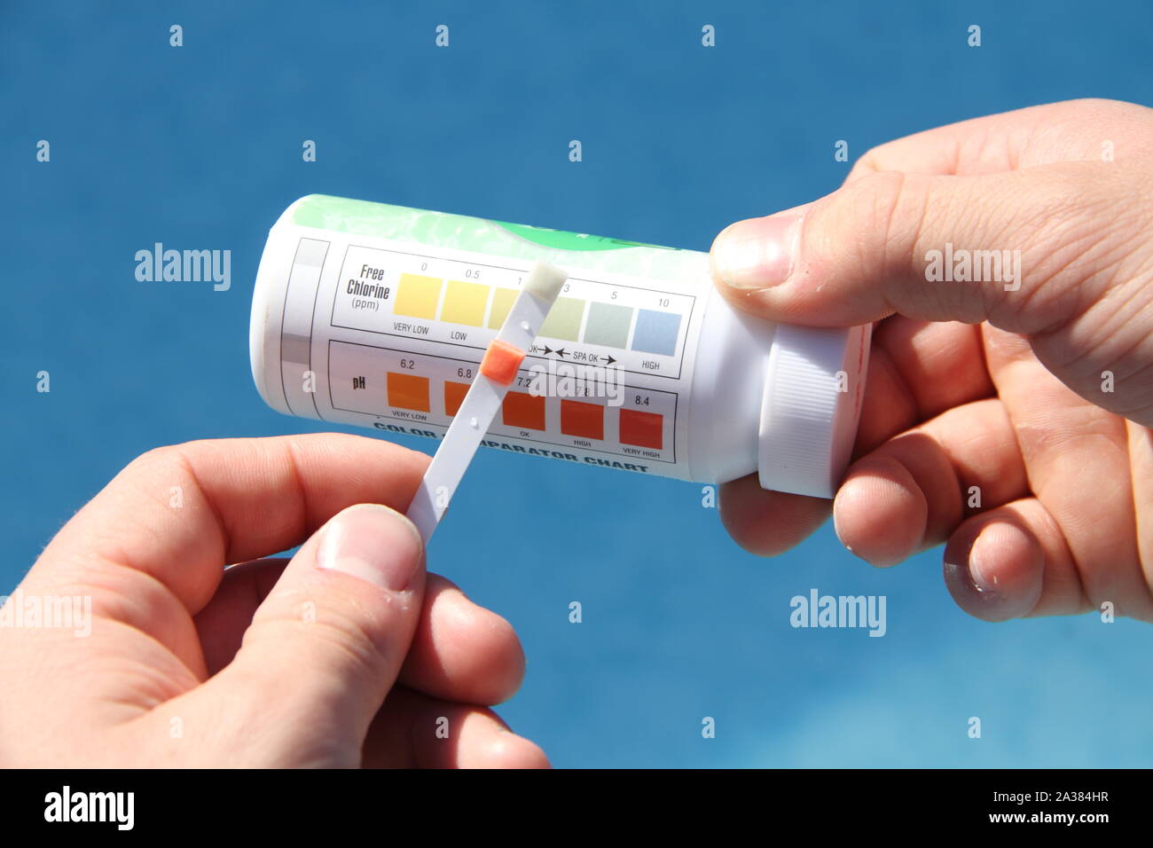 Test water in the pool for chlorine content Stock Photo - Alamy
