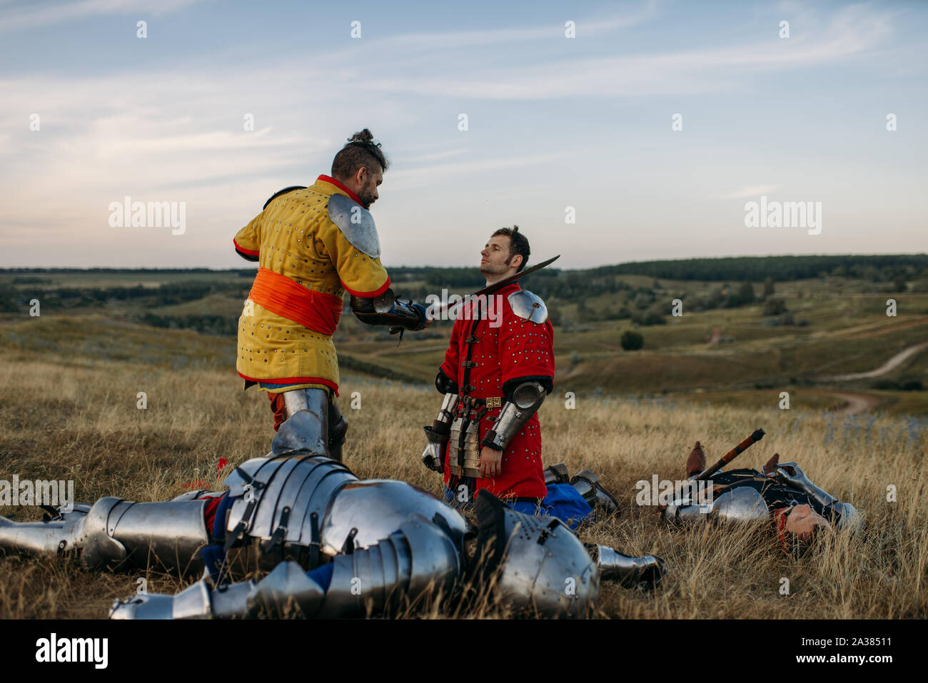 Medieval knight in armor prepares to cut off head Stock Photo - Alamy