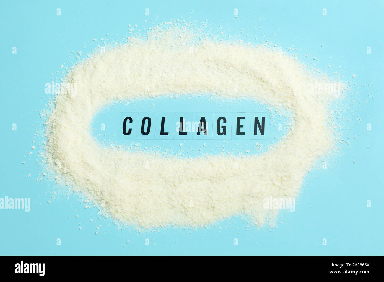 collagen protein powder on blue background - Hydrolyzed Stock Photo - Alamy