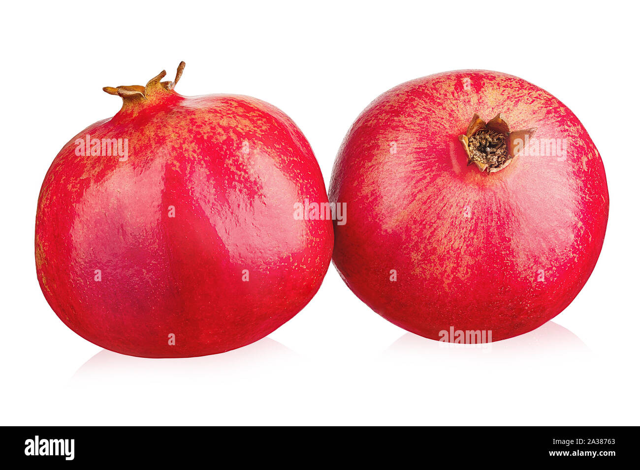 Two pomegranate fruits isolated on a white background. file contains ...