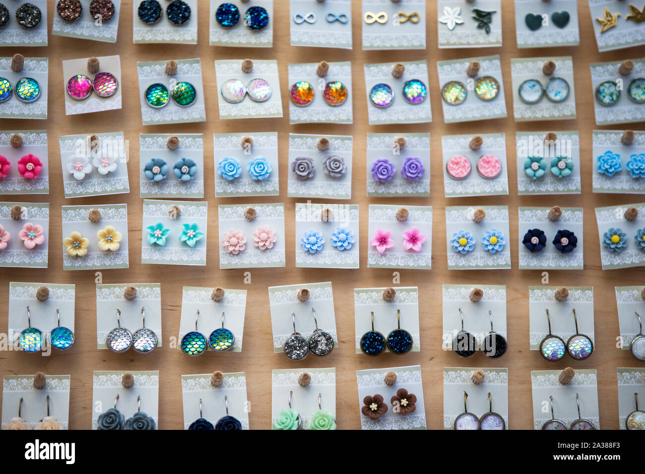 Many handmade earrings Stock Photo - Alamy