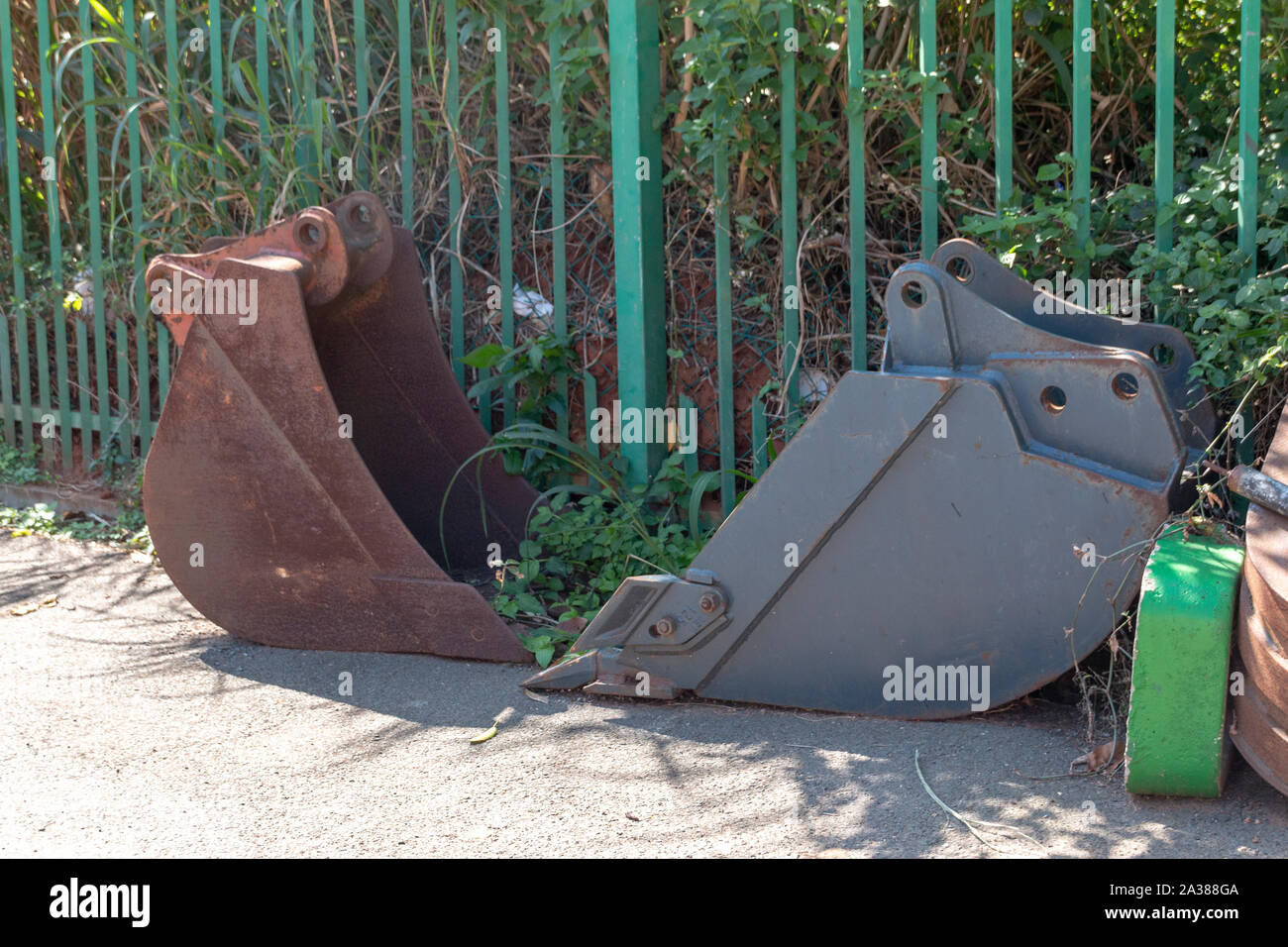 A close up view of two rusted old metal tractor arms Stock Photo - Alamy