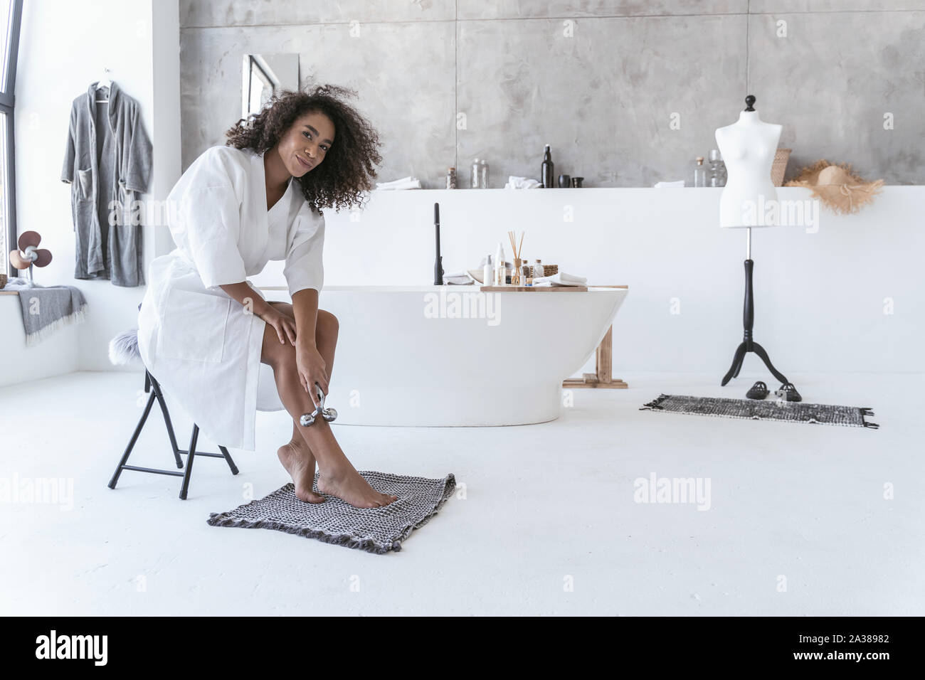 Happy lady taking care of her body Stock Photo - Alamy