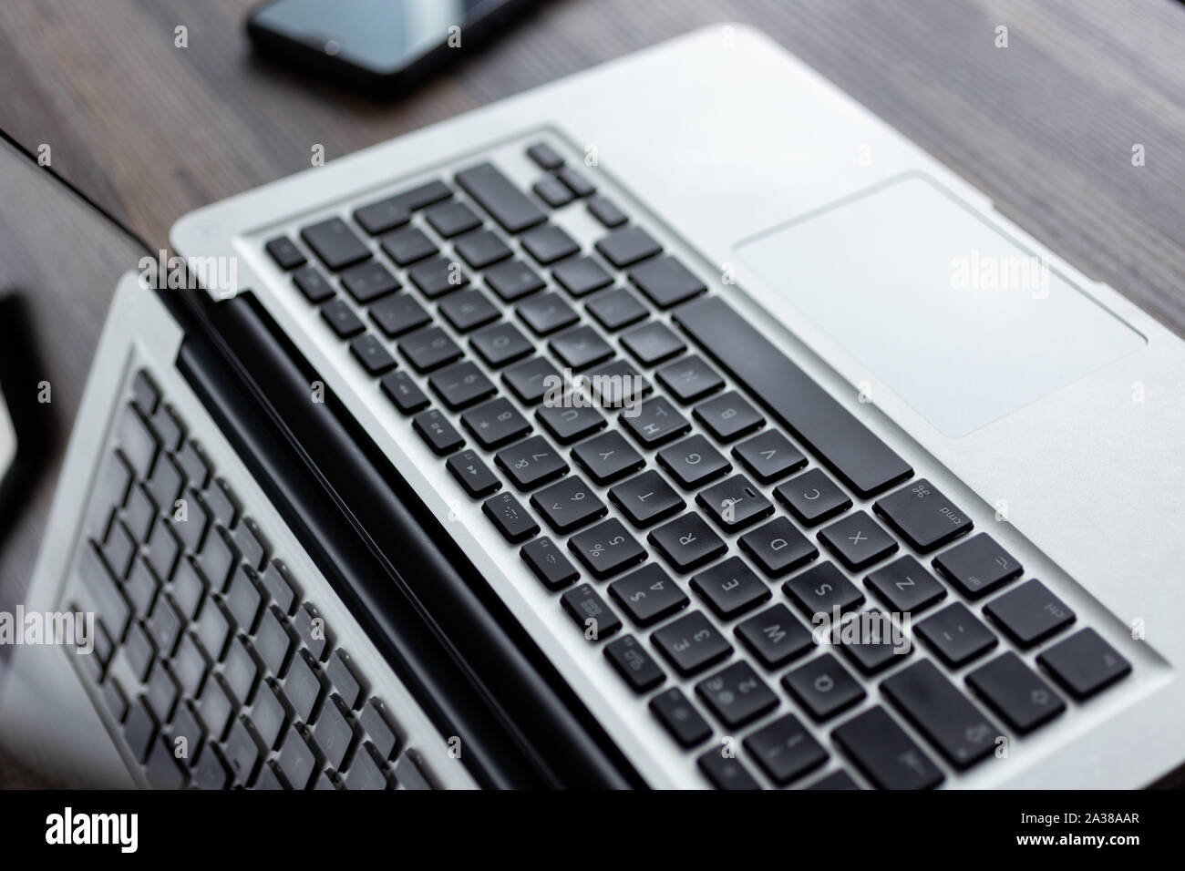 Silver white laptop computer keyboard from above Stock Photo - Alamy