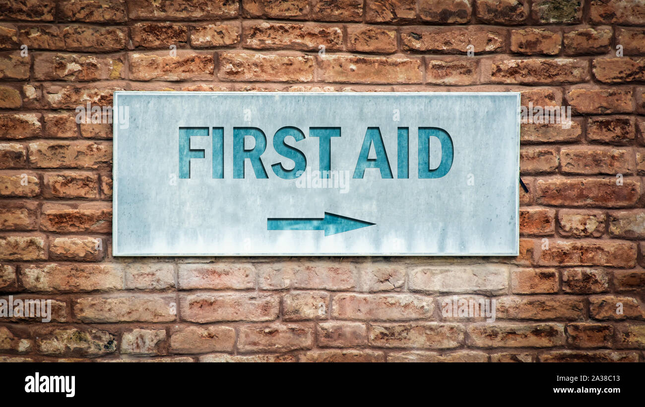 Street Sign the Direction Way to First Aid Stock Photo - Alamy