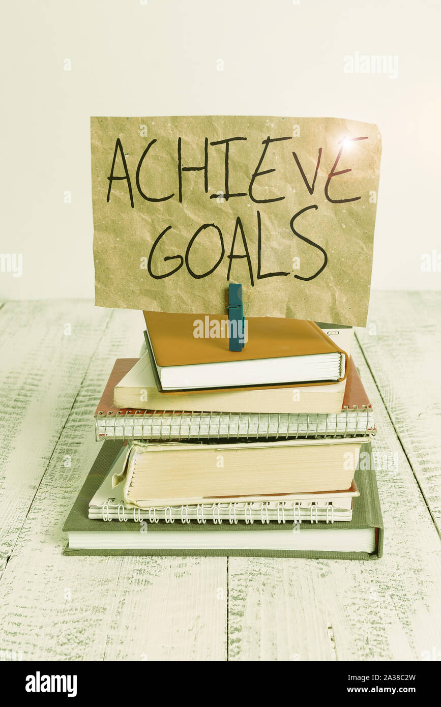 Writing note showing Achieve Goals. Business concept for Results ...