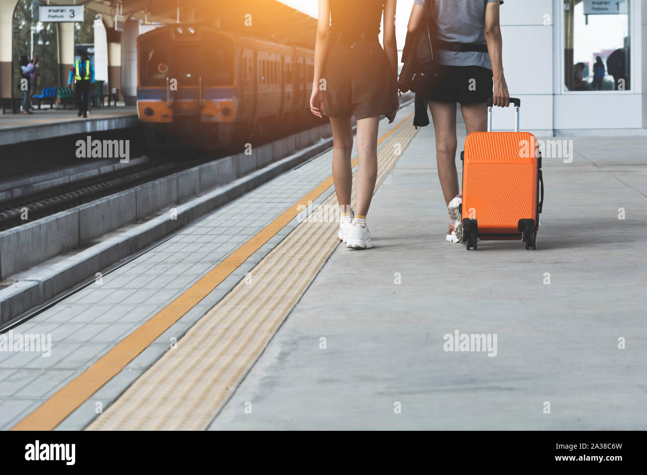 Dragging suitcase hi-res stock photography and images - Alamy