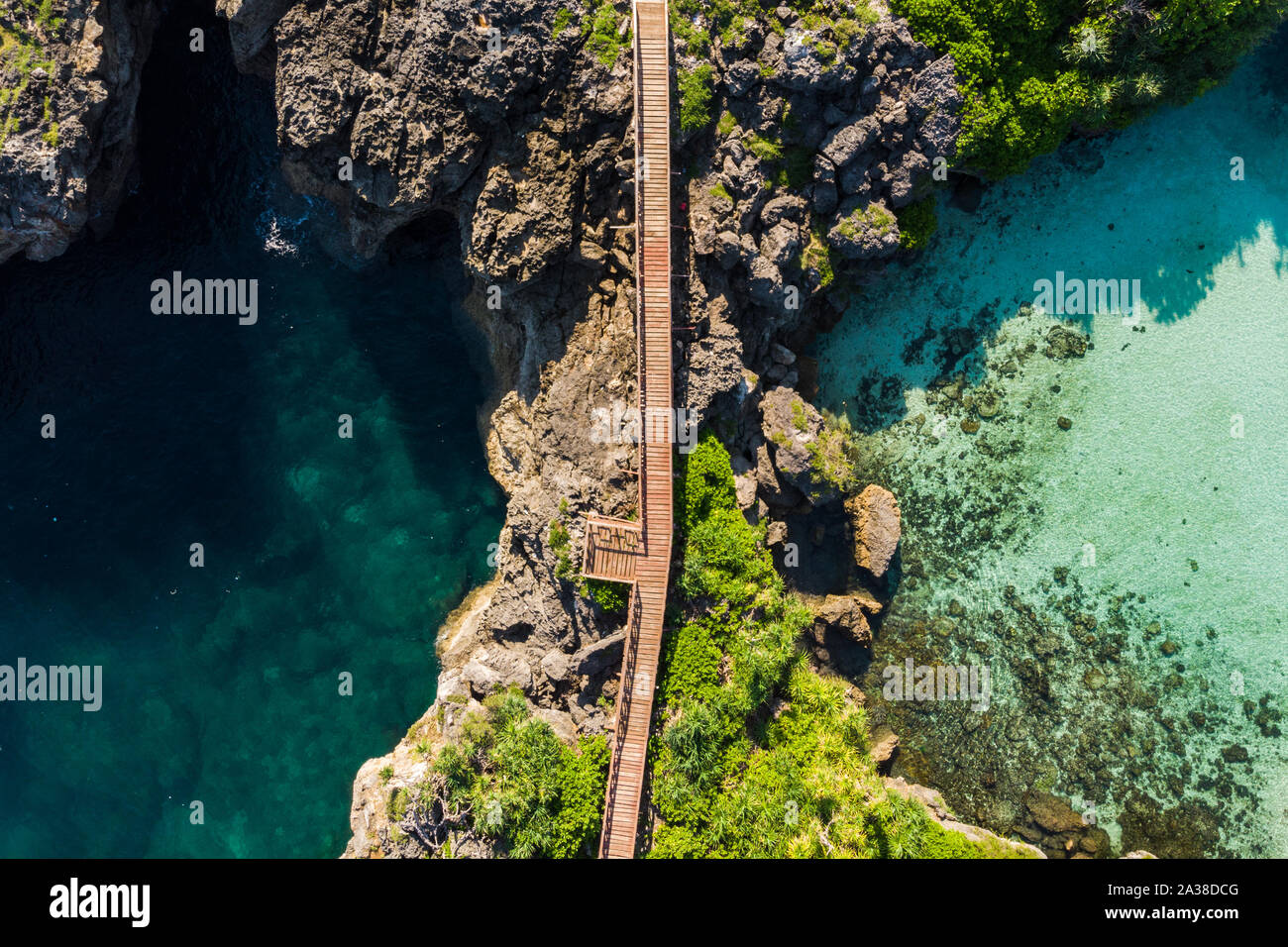 Footpath across the rocks between salt water lake and ocean, Weekuri ...