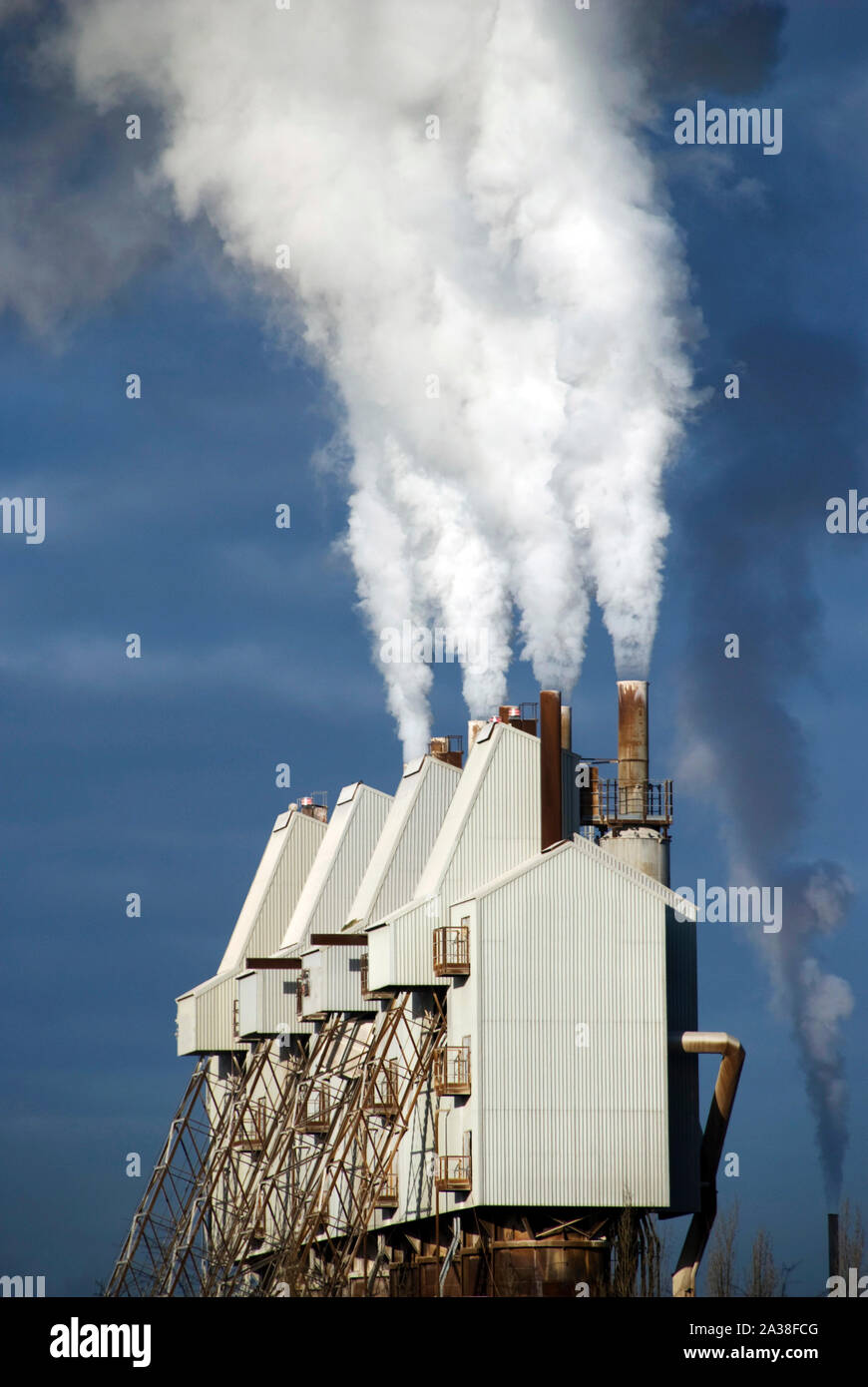 Smoke coming out factory chimneys hi-res stock photography and images ...