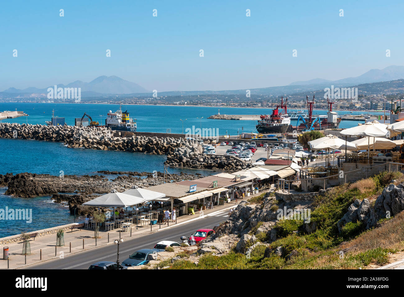 Rethymno, Crete, Greece. September 2019. Cargo ships alongside the quay ...