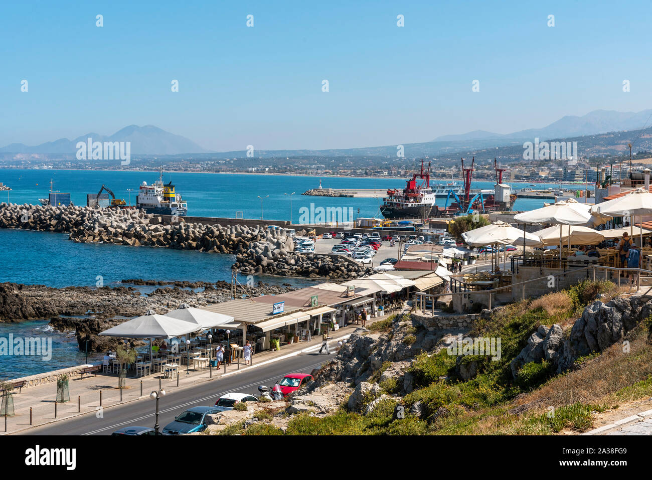 Rethymno, Crete, Greece. September 2019. Cargo ships alongside the quay ...