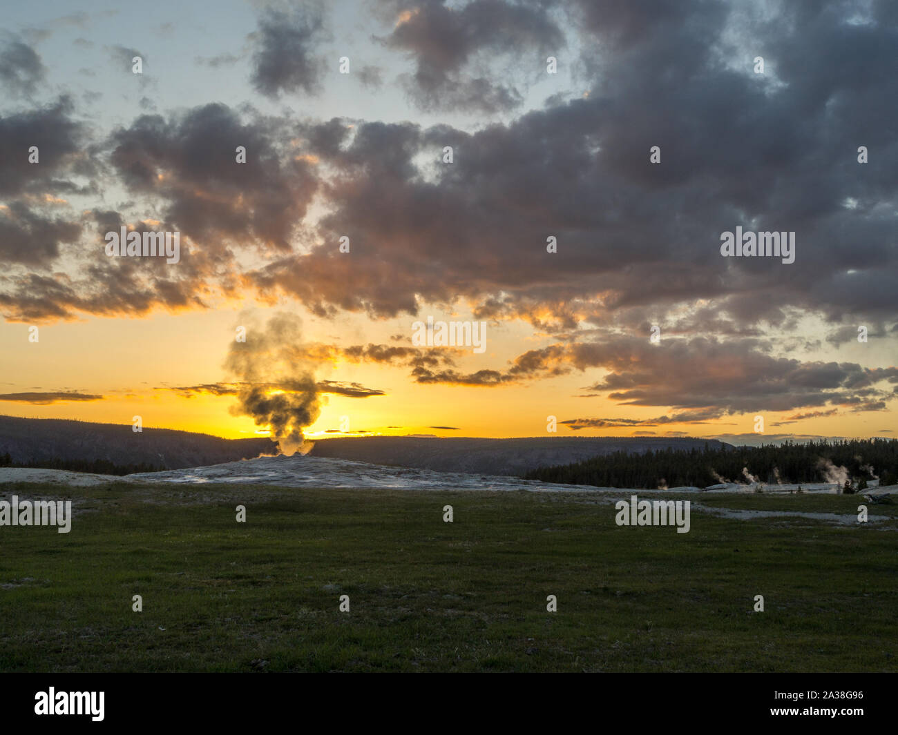Sunset Over Yellowstone's Iconic Old faithful Geyser Stock Photo - Alamy