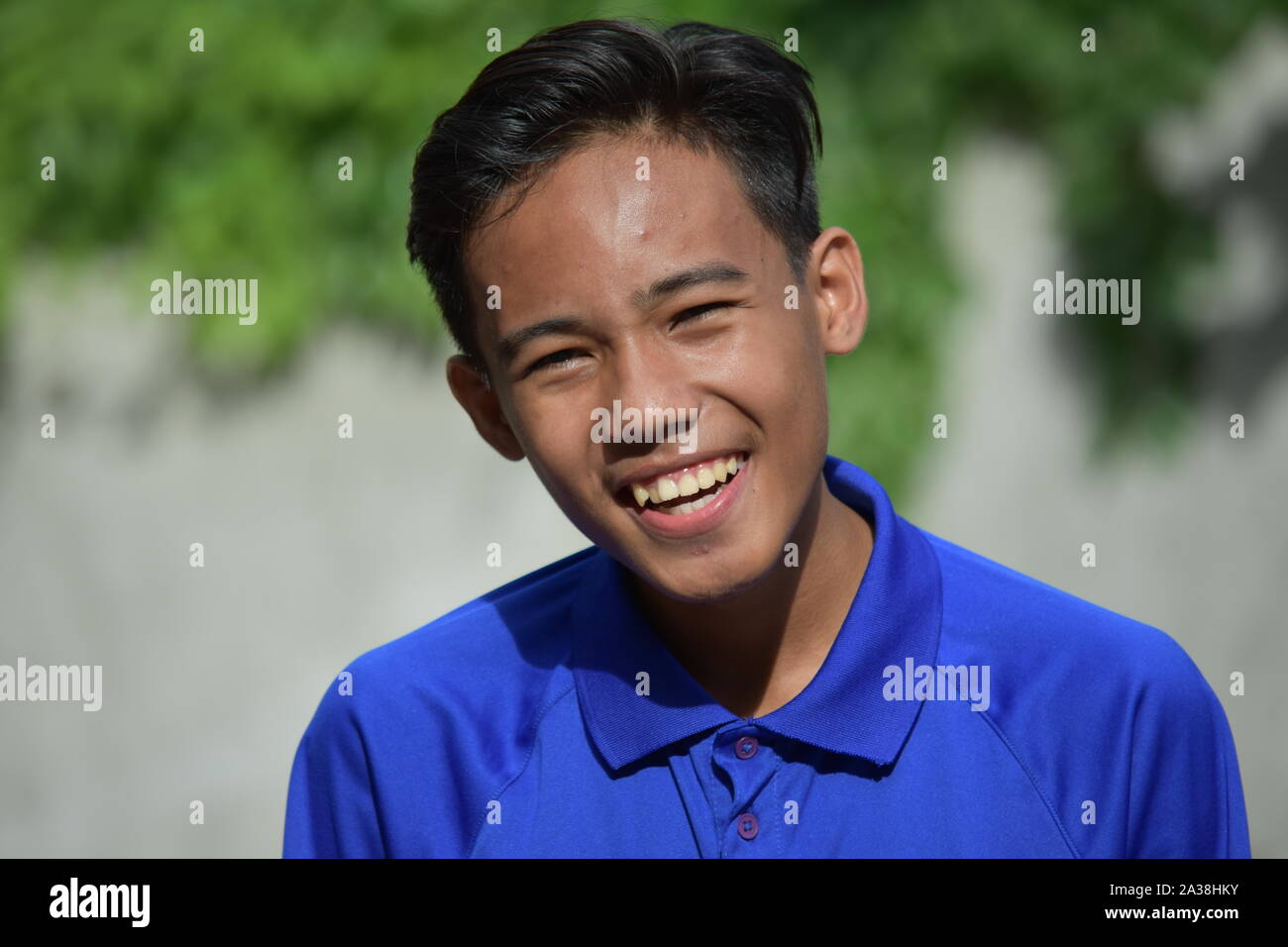Happy teenage boy smiling hi-res stock photography and images - Alamy