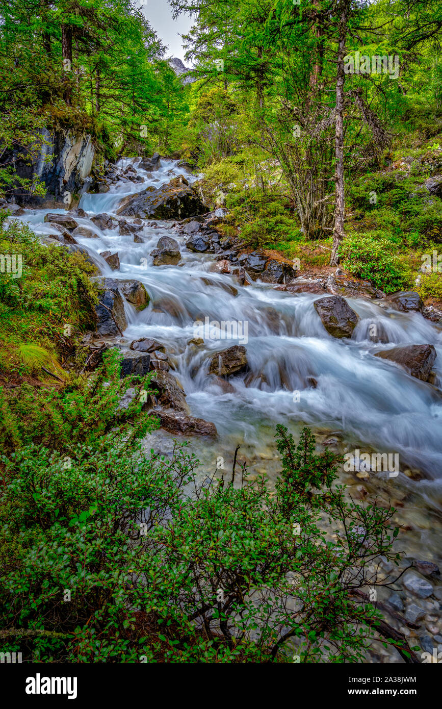 Fast flowing rapids against rocks and cairns Stock Photo - Alamy