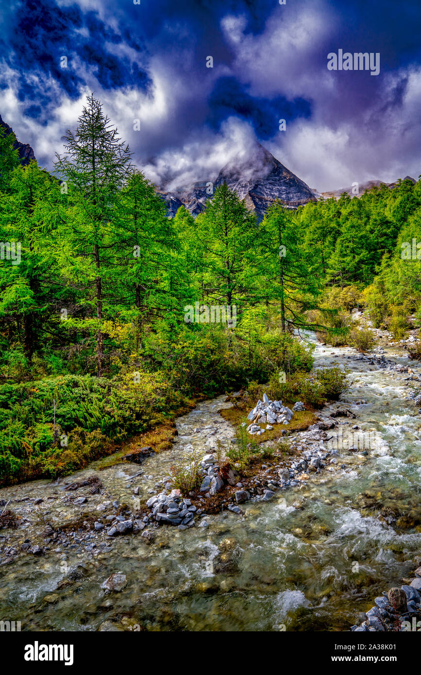 Fast flowing rapids against rocks and cairns Stock Photo - Alamy