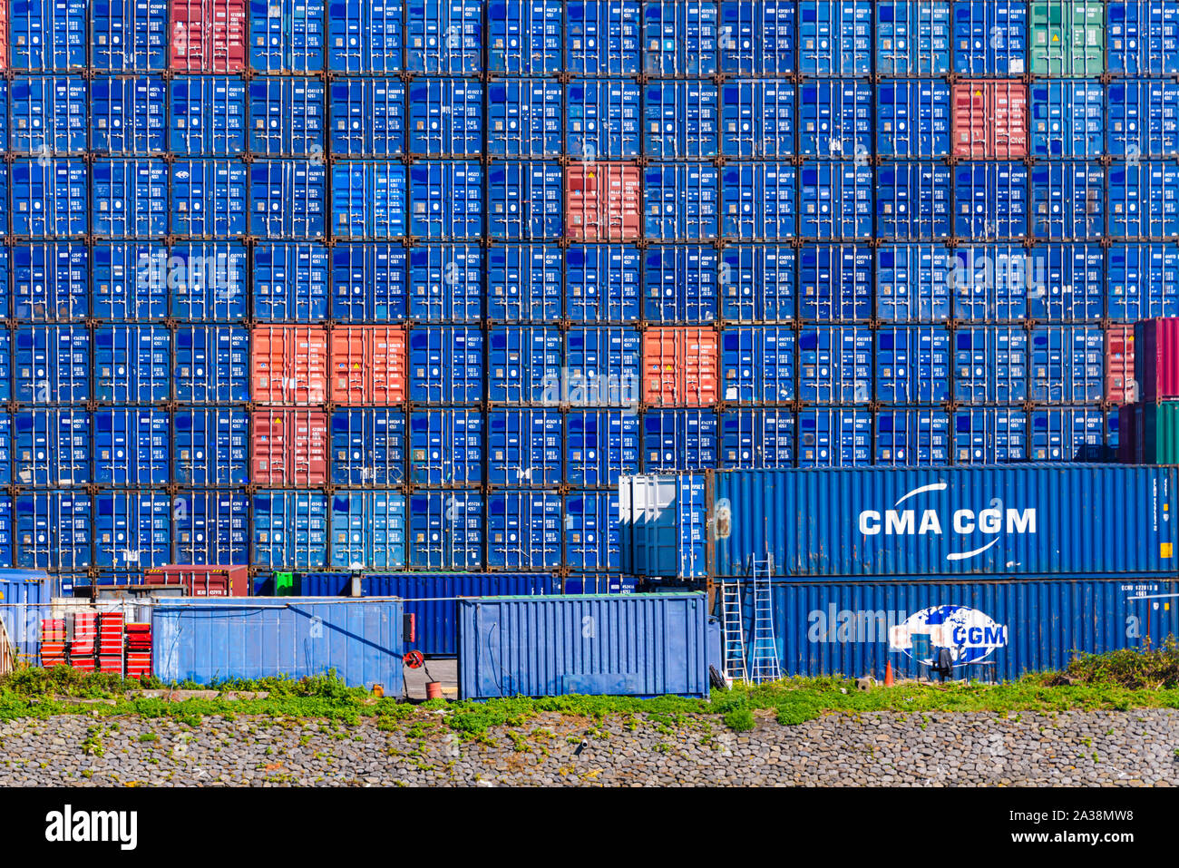 Shipping containers stacked up in the port of Rotterdam, Netherlands ...