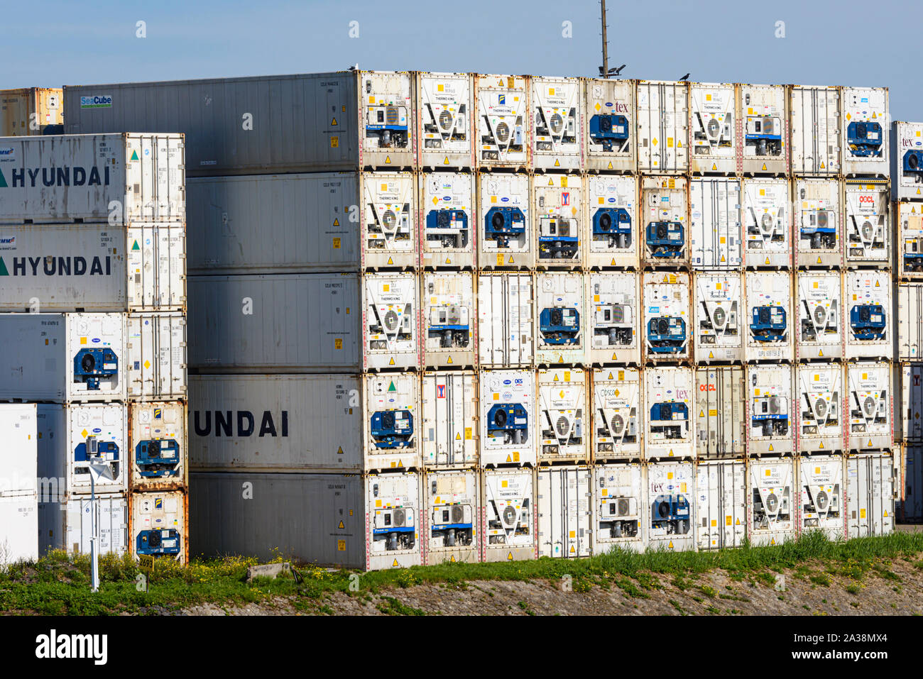 Shipping containers stacked up in the port of Rotterdam, Netherlands ...